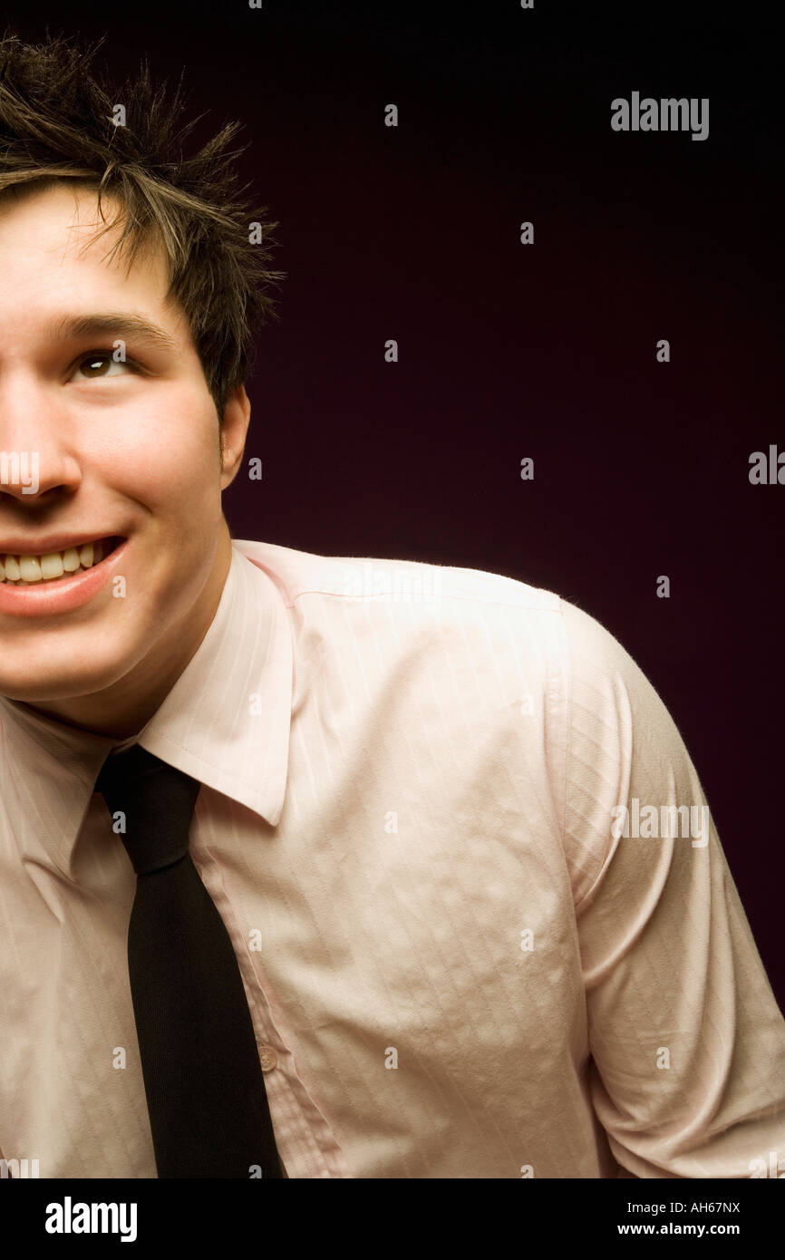 Young man looking up and smiling Stock Photo - Alamy