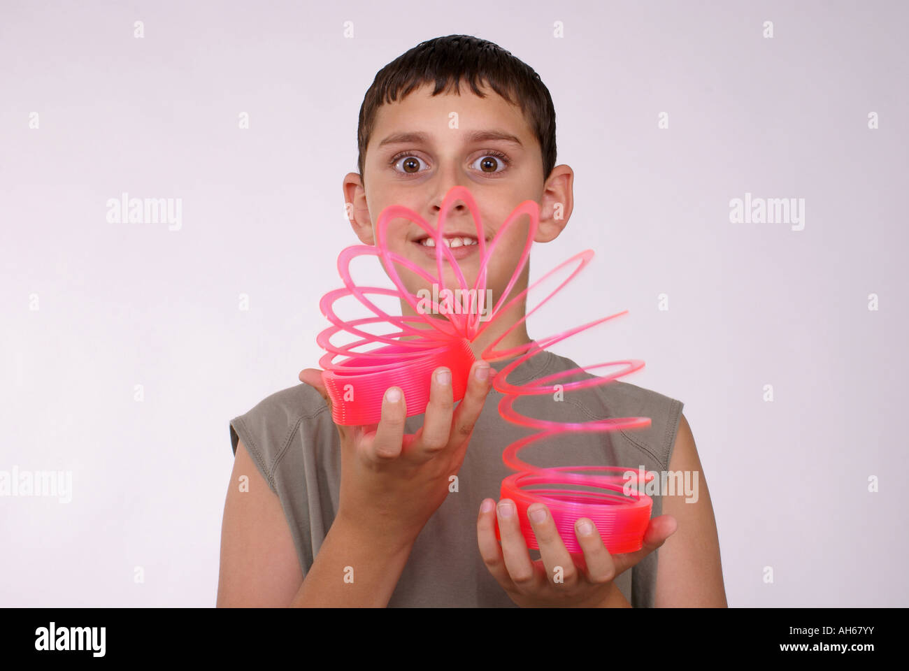Playing with Slinky Stock Photo - Alamy