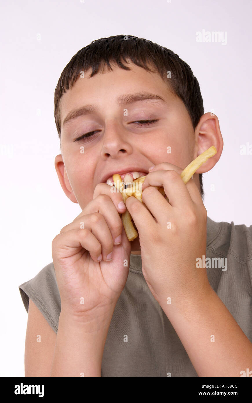 Stuffing his mouth Stock Photo - Alamy