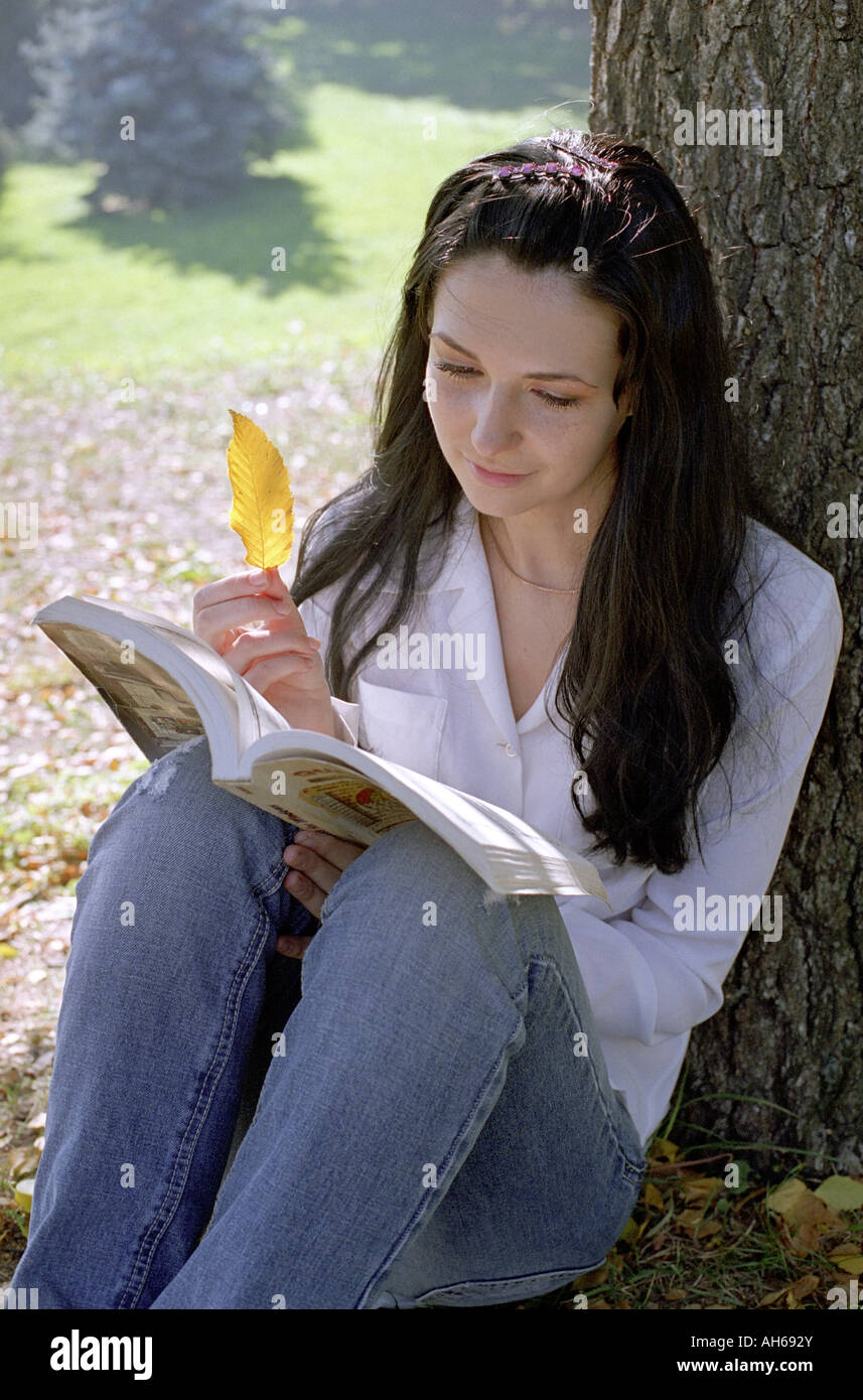 woman read a book under tree Stock Photo - Alamy