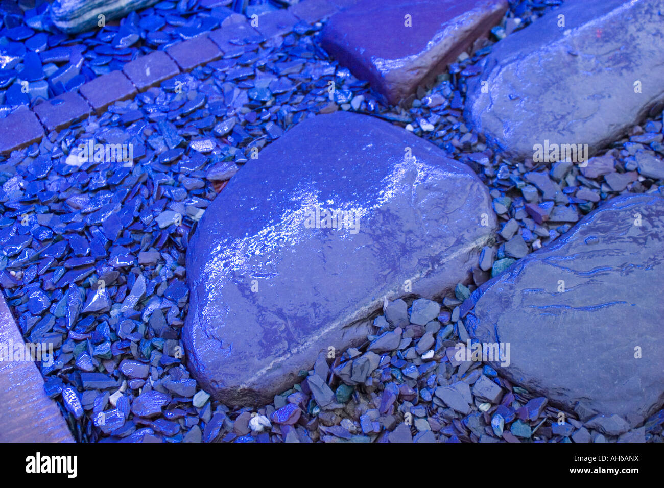 Pebbles in blue light Stock Photo - Alamy