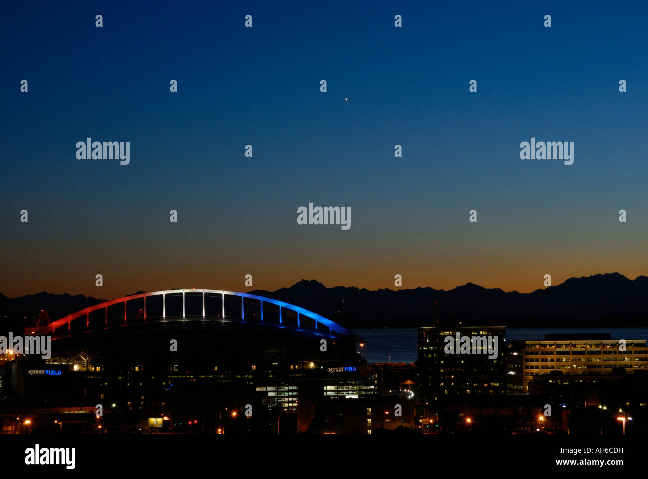 Seattle's Qwest field and the Olympic Mountains at dusk Stock Photo - Alamy