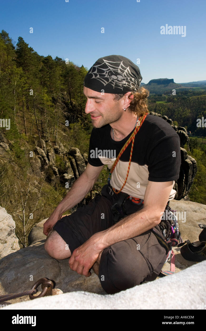 Free Climber sitting on summit after succesful climb Hirschgrund Elbe ...