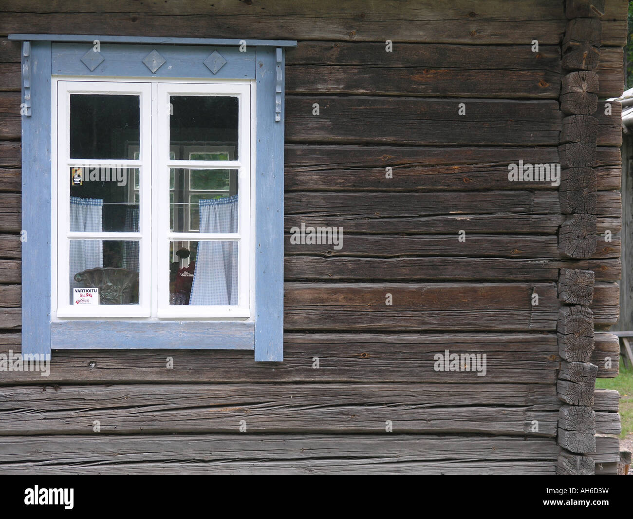 blue framde window in traditional wooden log house in country museum ...