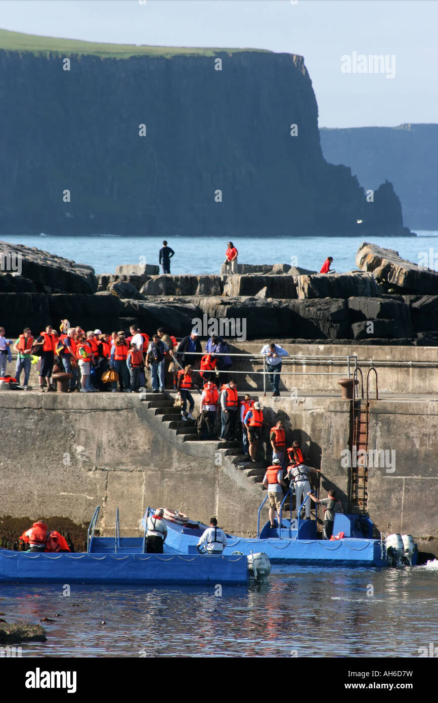 tourists boarding tenders in Doolin harbour for the ferry to the Aran ...