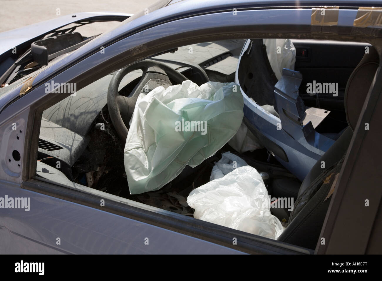 Opened destroyed airbag in old crashed car Stock Photo - Alamy