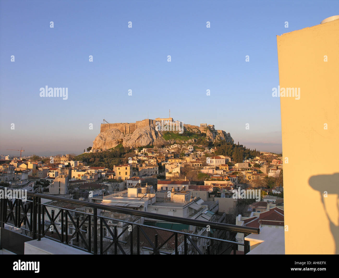 View in sunlight over the roofs of old town Plaka with Acropolis Athens ...
