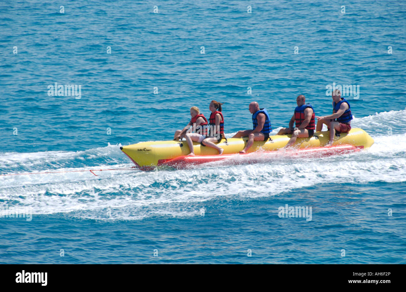 Banana boat being towed by speedboat off Nissi Beach near Ayia Napa on ...