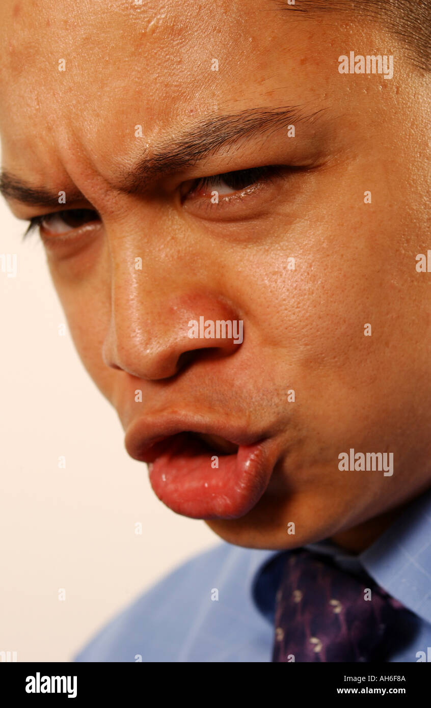 Man pouting lips in anger hi-res stock photography and images - Alamy