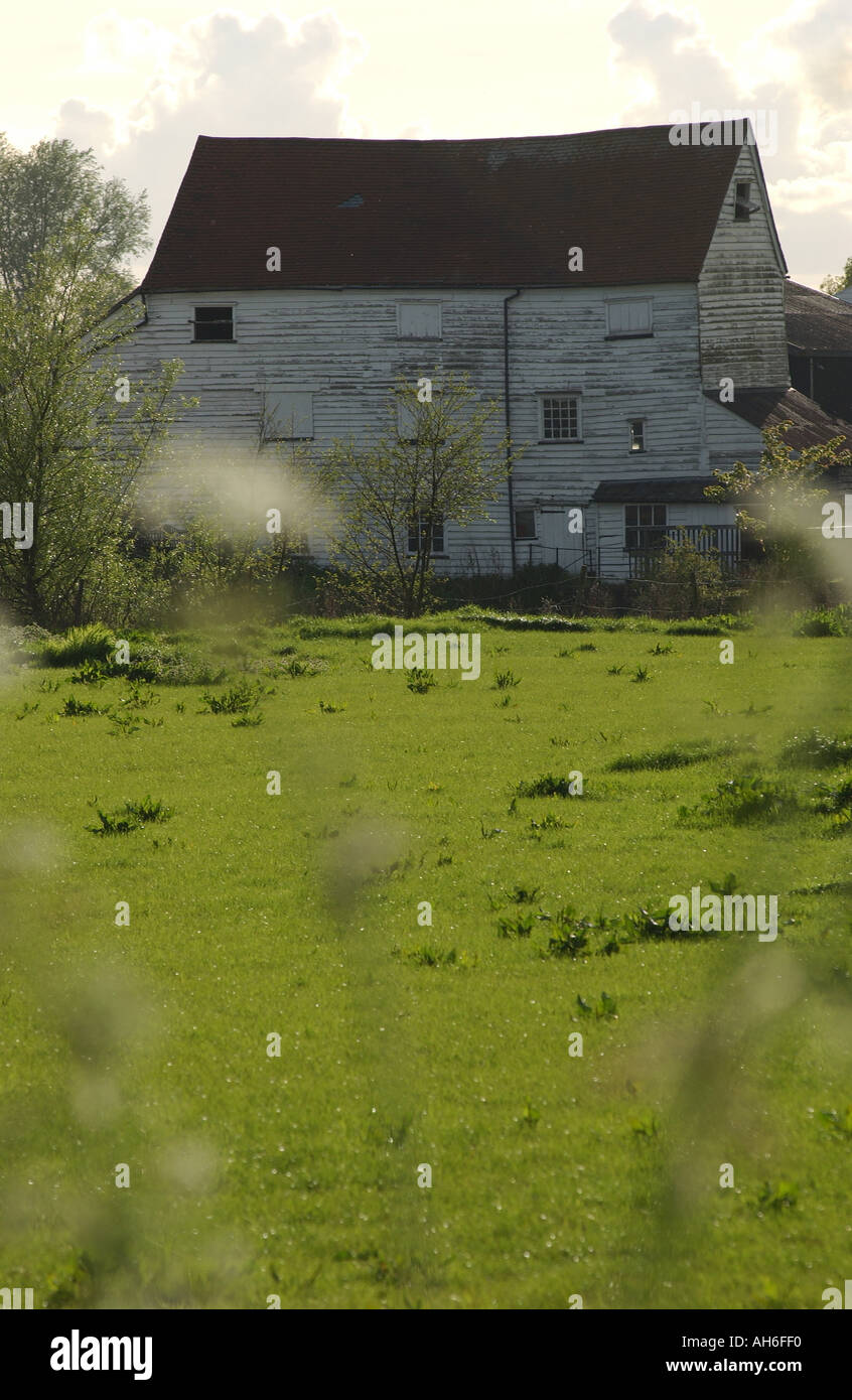 White wooden slatted barn in field Stock Photo - Alamy