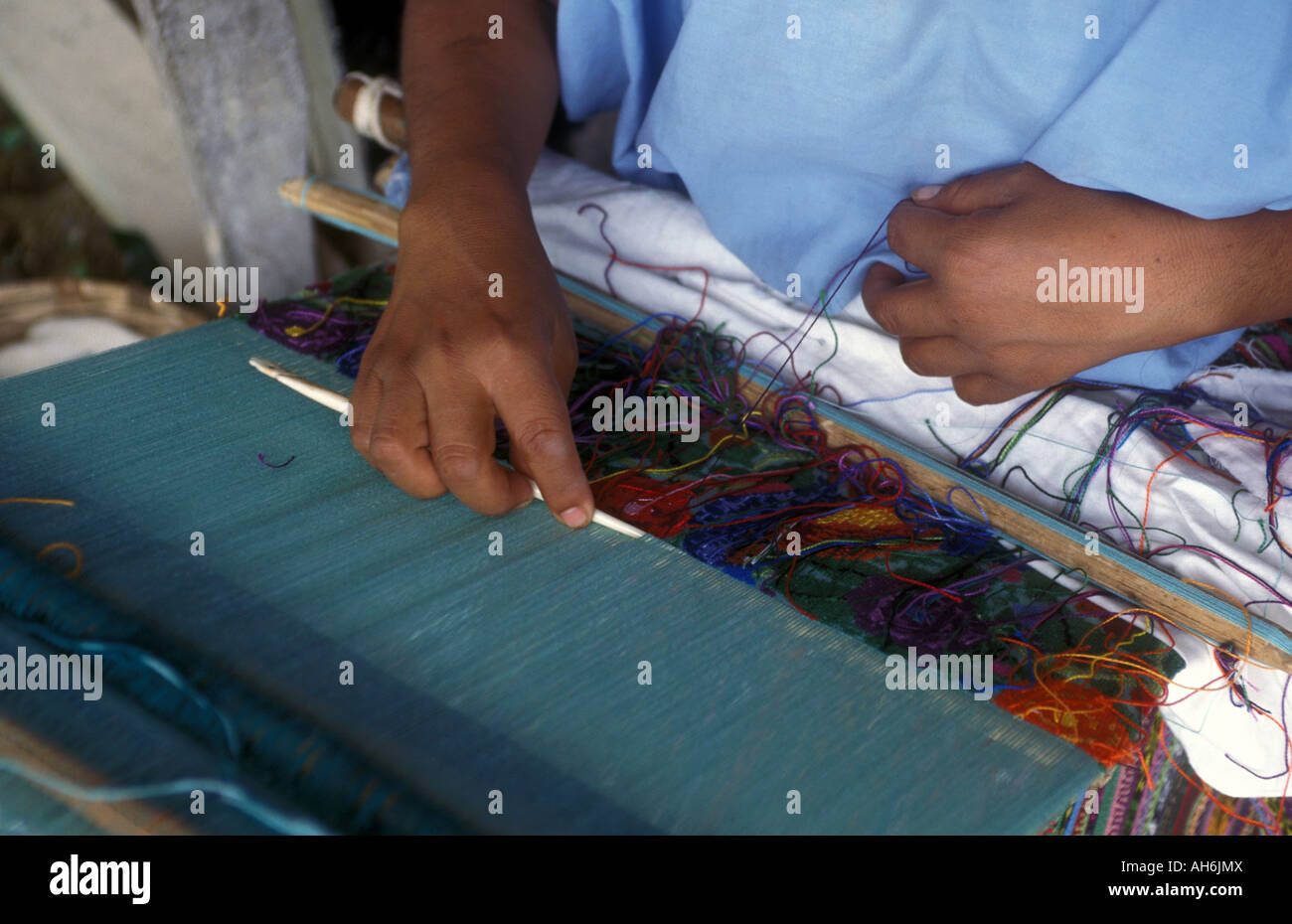 Maya girl weaving in Guatemala detail of hands Stock Photo - Alamy