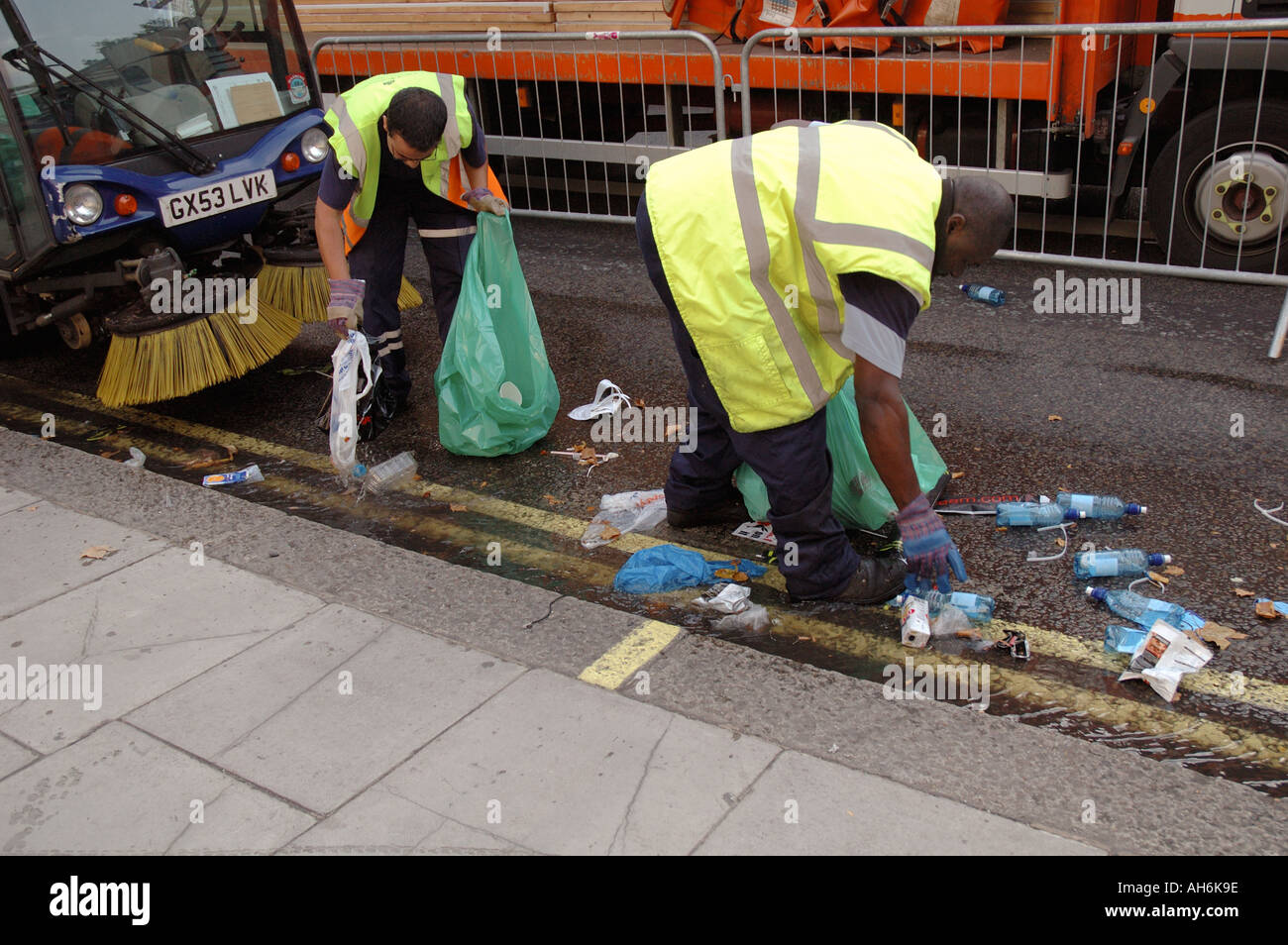 Street cleaners in central London clearing debris Stock Photo - Alamy