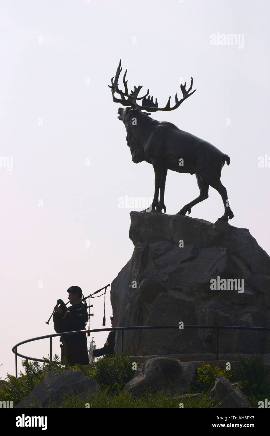 Bagpipe player in front of caribou statue at Beaumont Hamel ...
