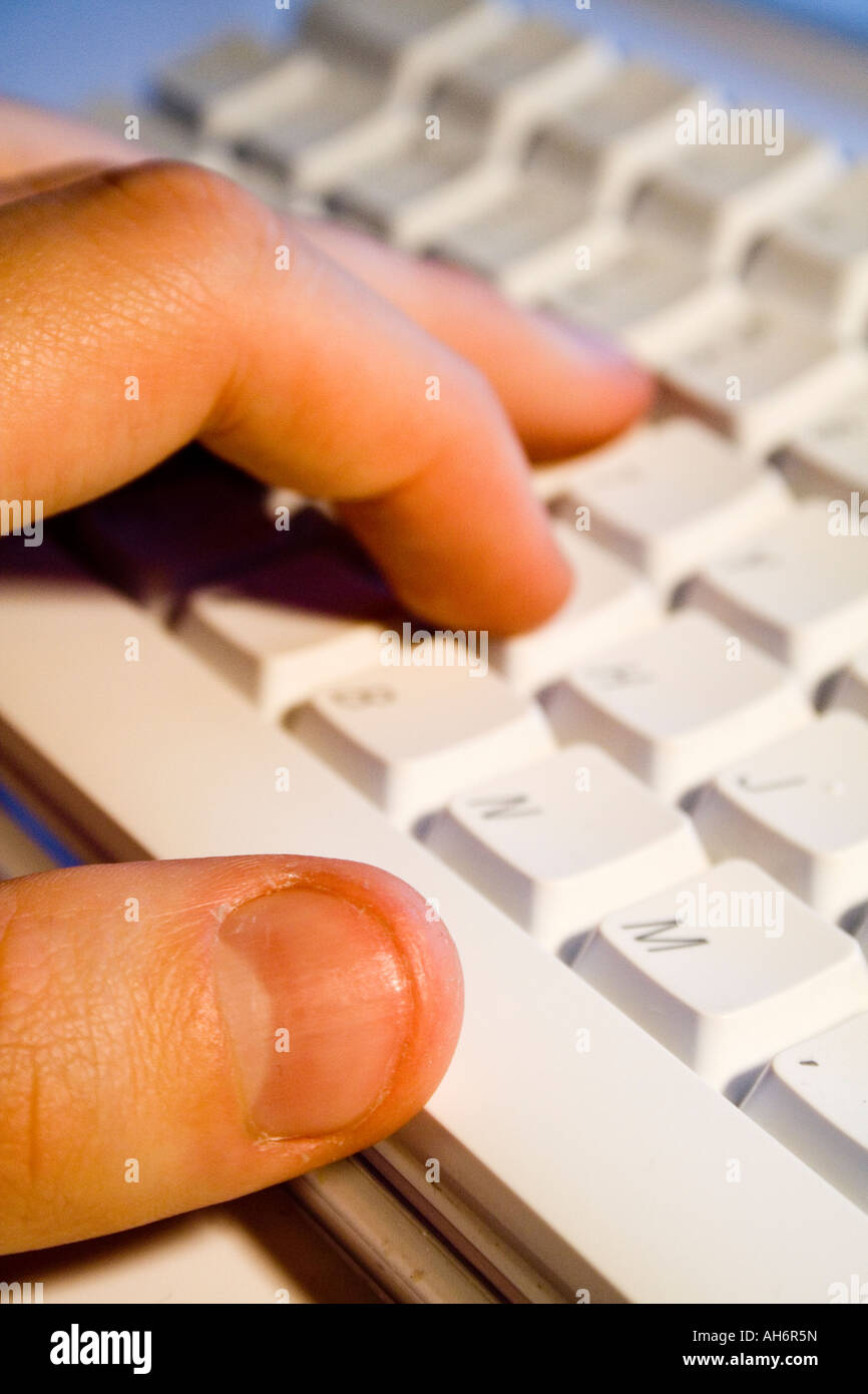 Hand on keyboard typing Stock Photo - Alamy
