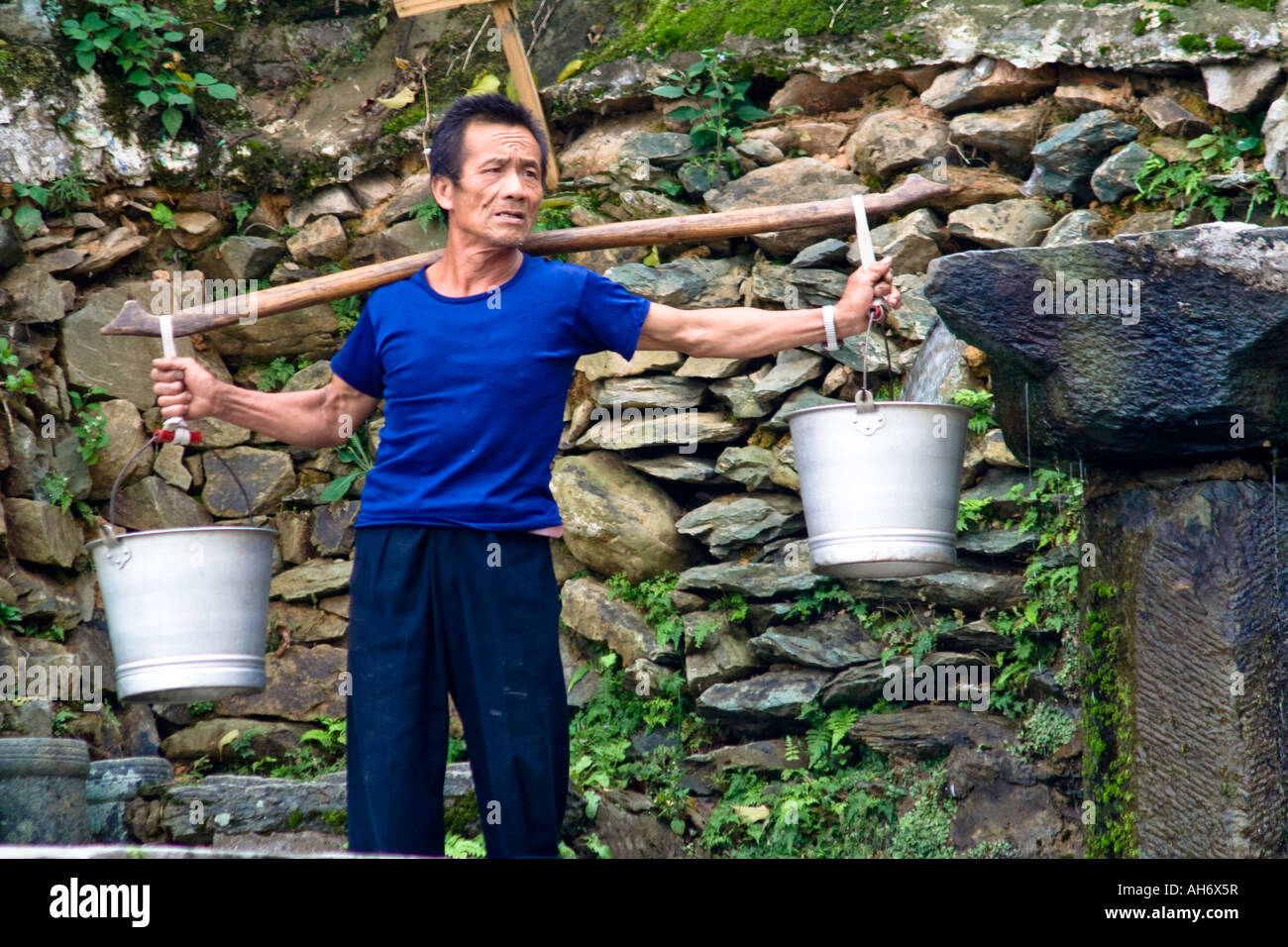 Dong Ethnic Minority Chinese Man Filling Shoulder Carried Water Buckets ...