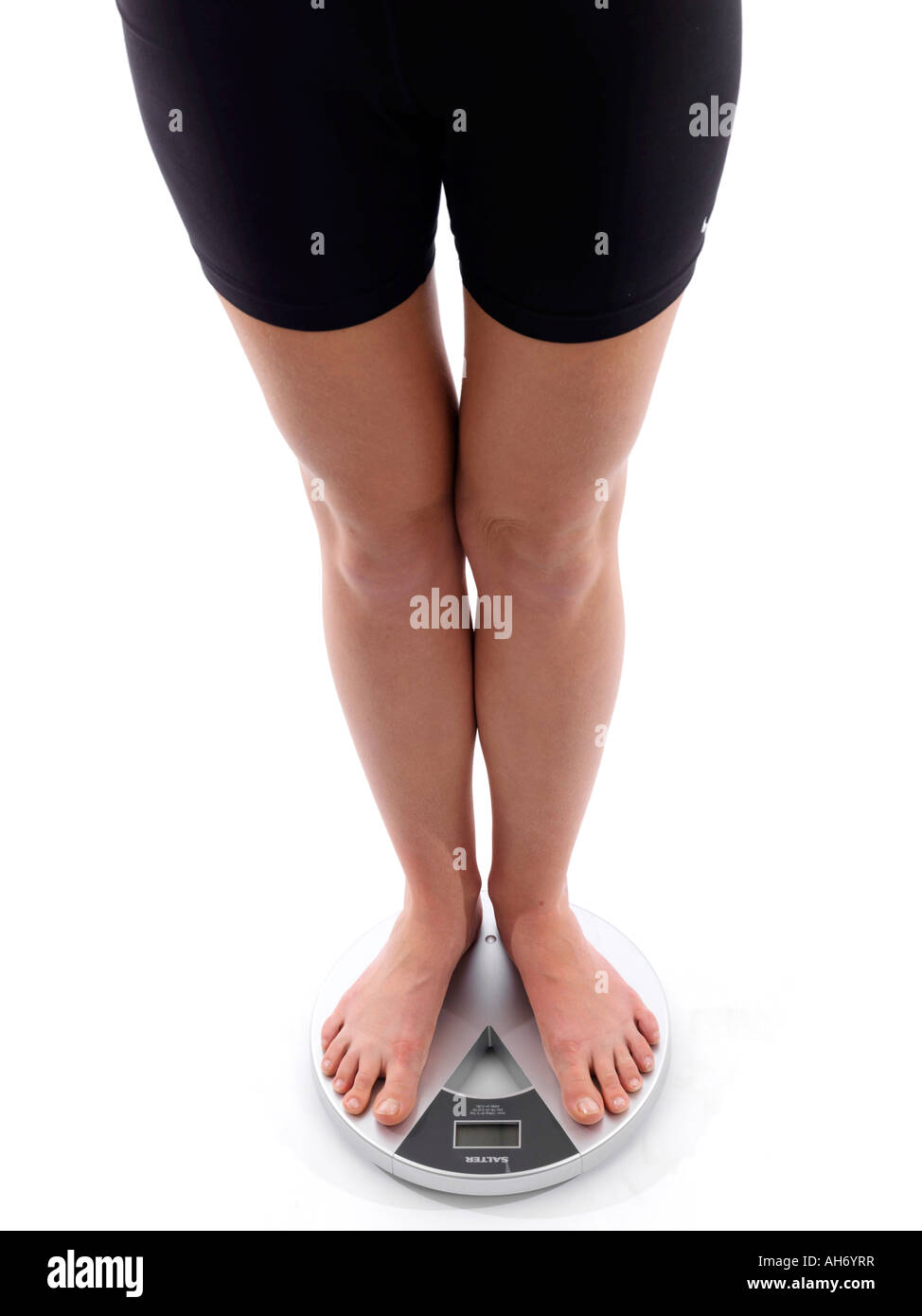 Young Woman using Scales Model Released Stock Photo - Alamy