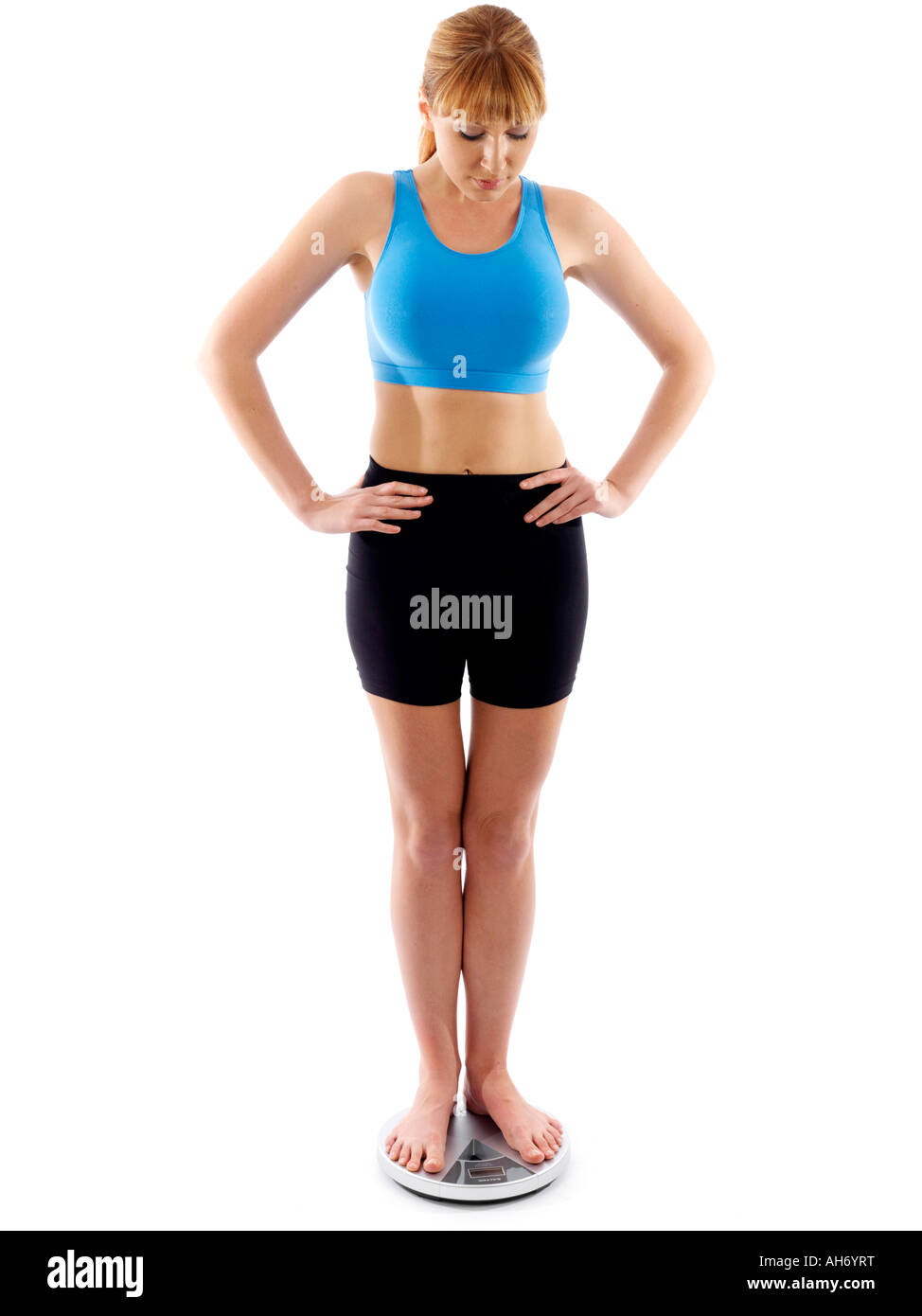 Young Woman using Scales Model Released Stock Photo - Alamy