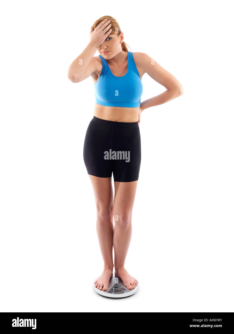 Young Woman using Scales Model Released Stock Photo - Alamy
