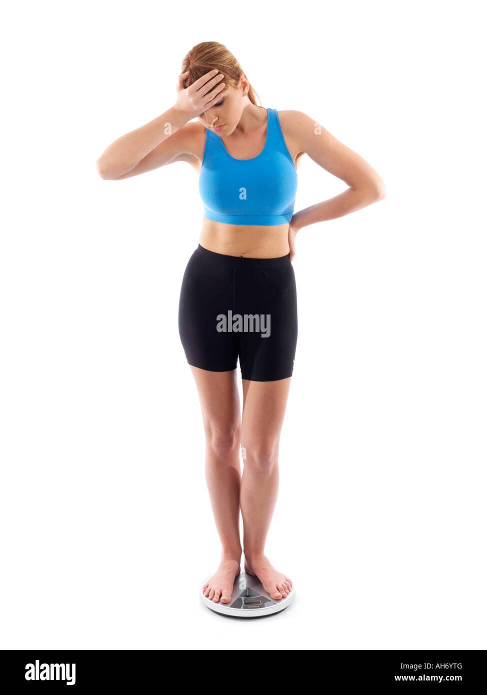 Young Woman using Scales Model Released Stock Photo - Alamy