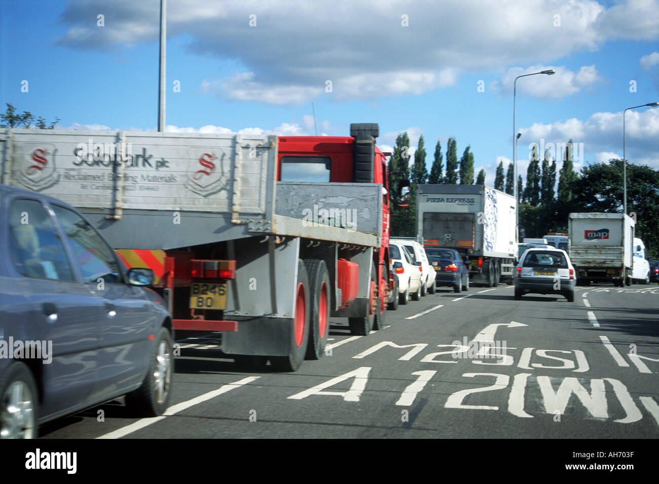 Traffic queue on motorway in England showing cars and lorries with road ...