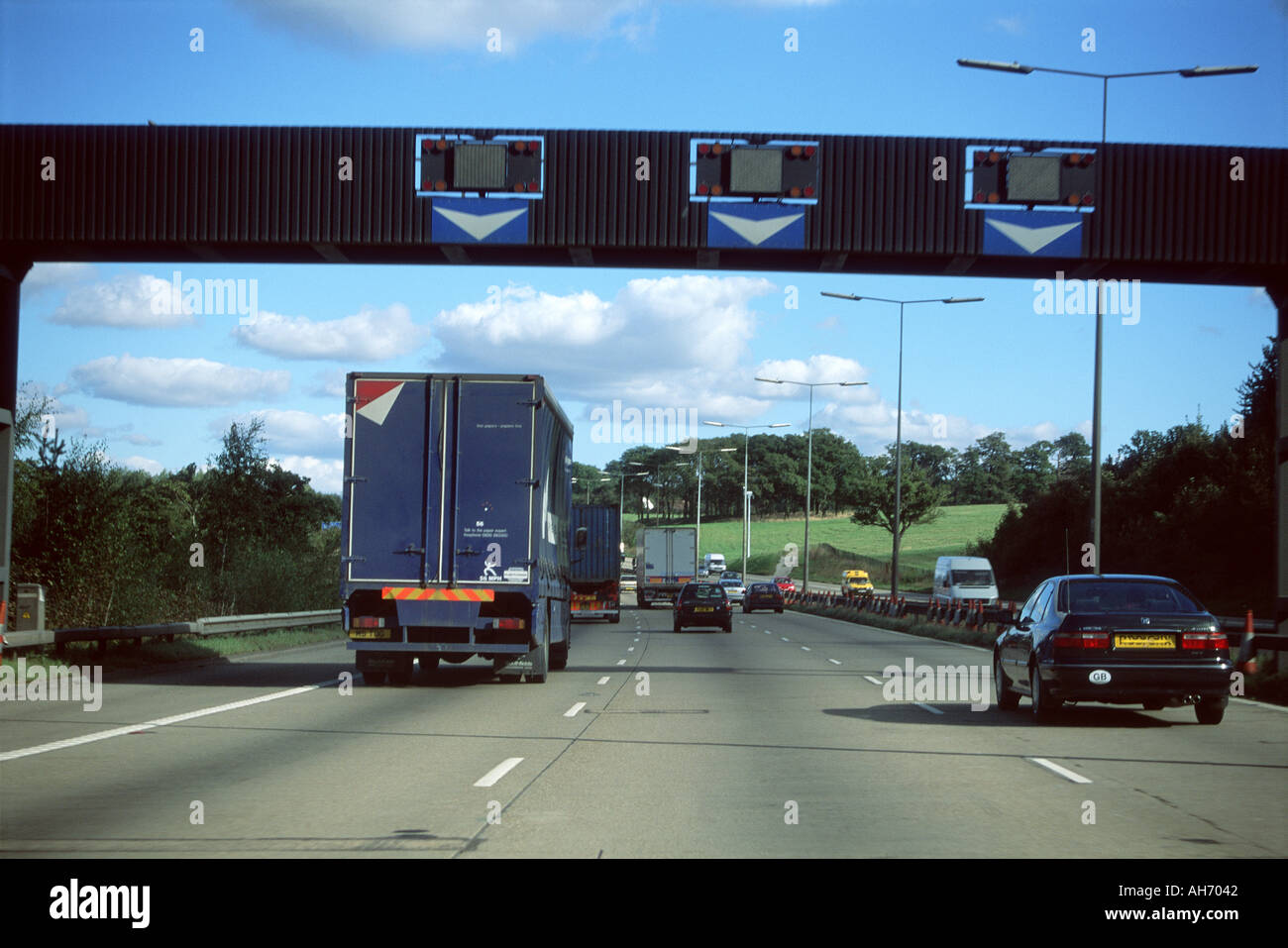 Lorries and cars on motorway Stock Photo - Alamy