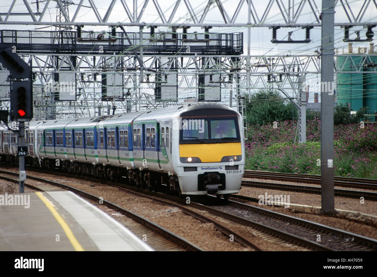 Train arriving at station platform Stock Photo - Alamy
