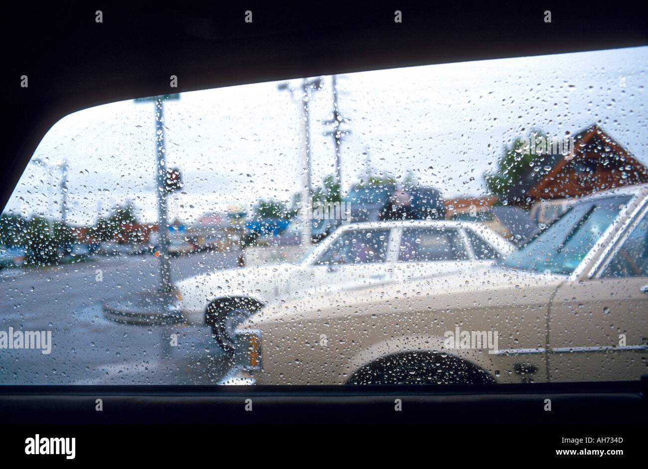 Water drops form on car window during rain storm Stock Photo - Alamy