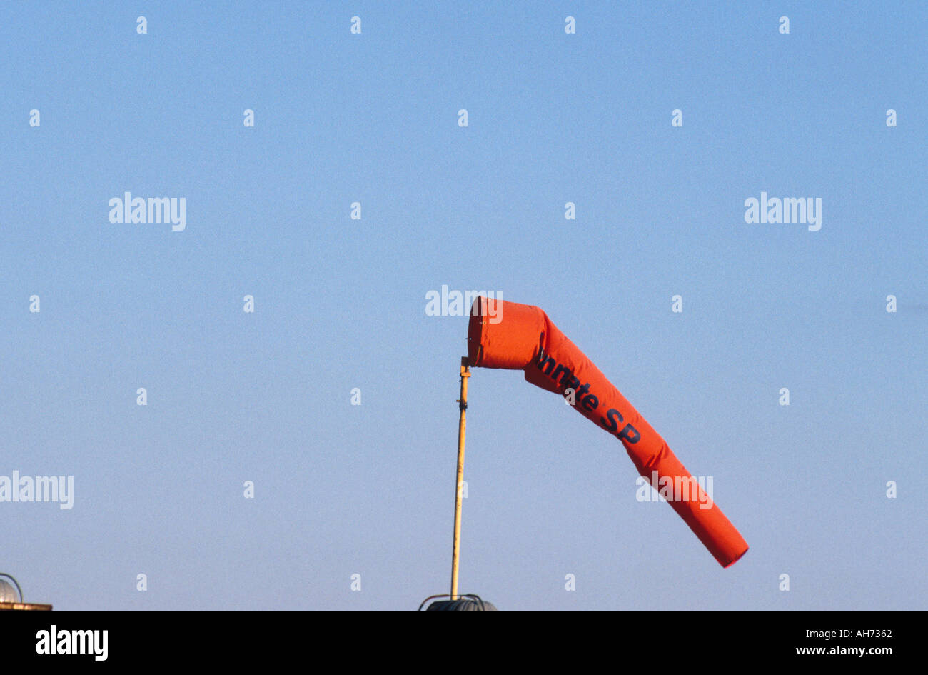 Wind sock indicates wind direction at airport Stock Photo - Alamy