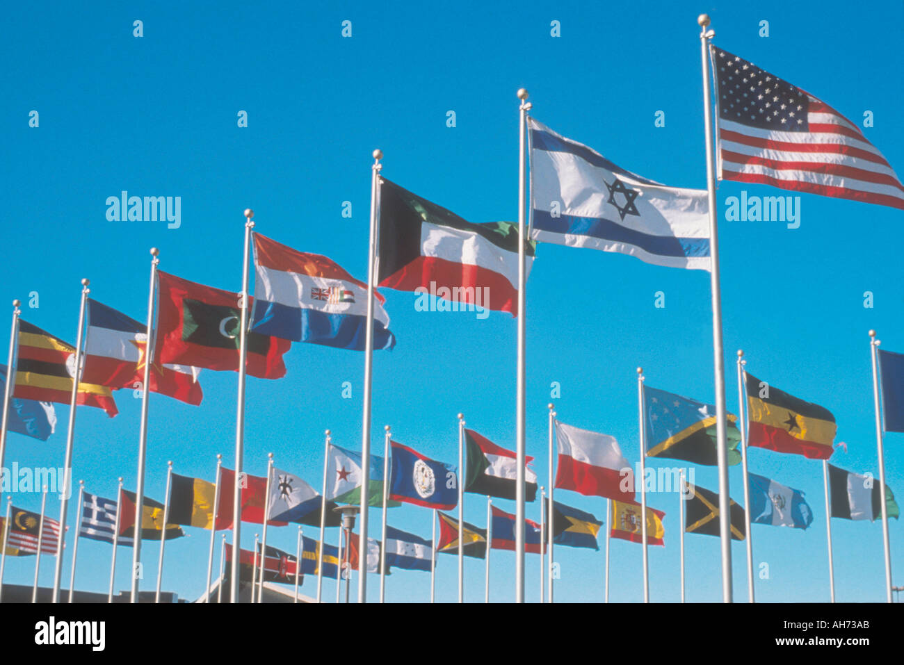 Flags of many nations flying on flag poles at church in Lansing ...