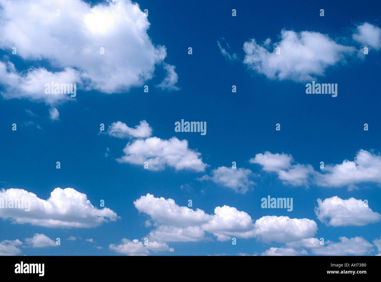 Cumulus clouds in a blue sky Stock Photo - Alamy