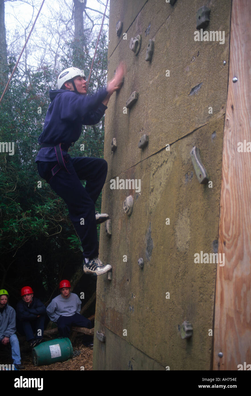 Teenager scaling a climbing wall Stock Photo - Alamy