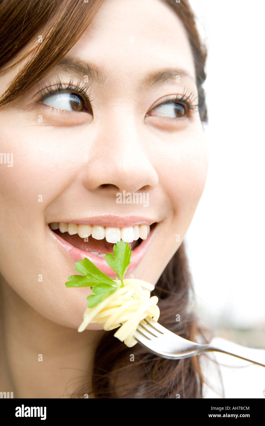 A female is eating her lunch Stock Photo - Alamy