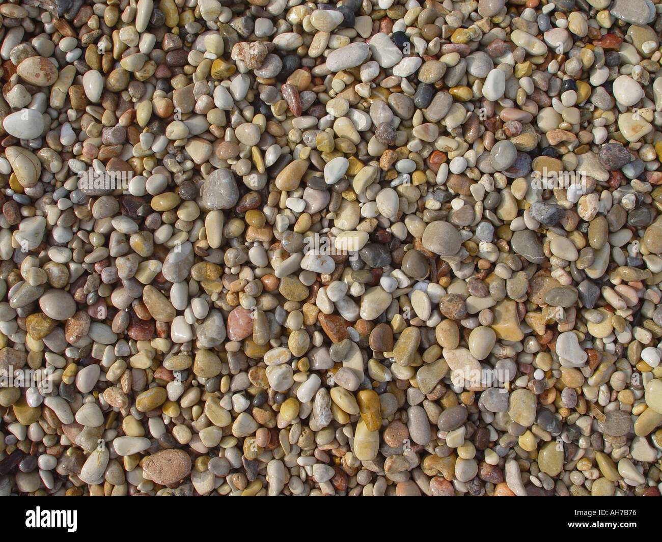 Pebbles and shingle on Mediterranen beach in Balearic Island of Ibiza ...
