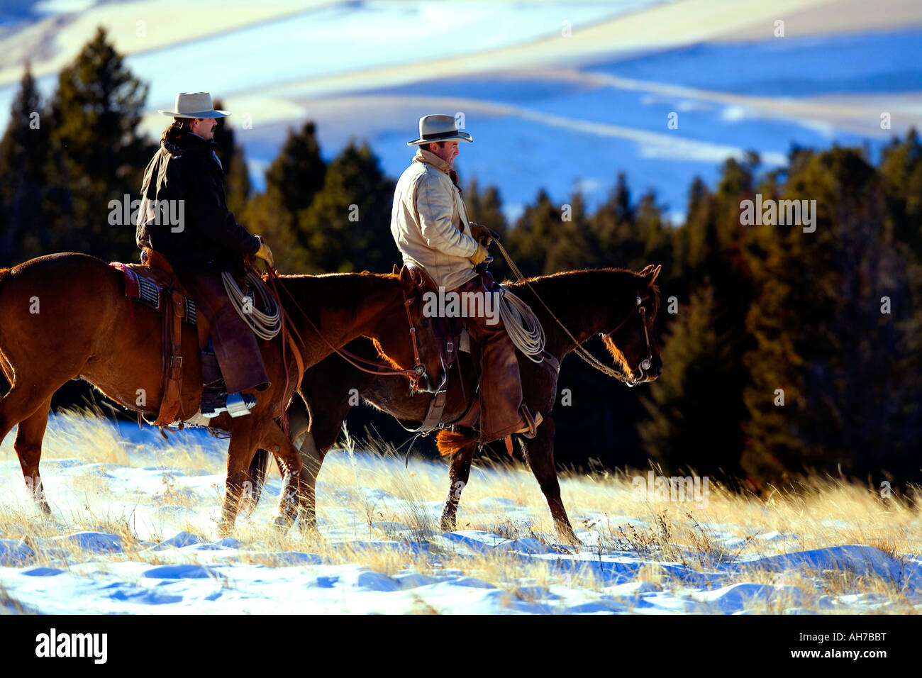 Cowboy on horseback in snow hi-res stock photography and images - Alamy