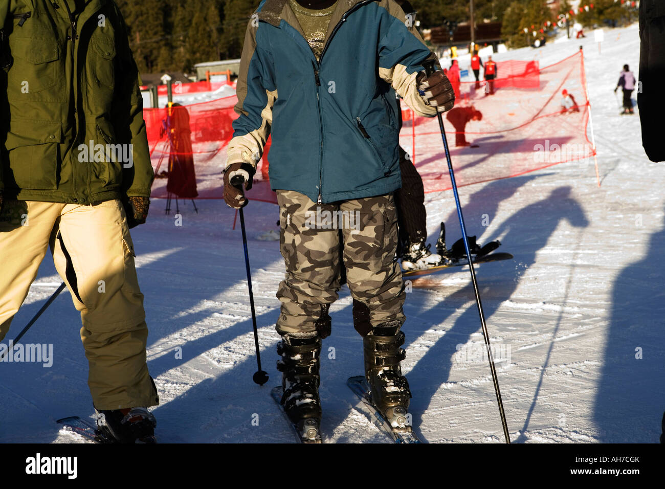 Low section view of two people skiing Stock Photo - Alamy
