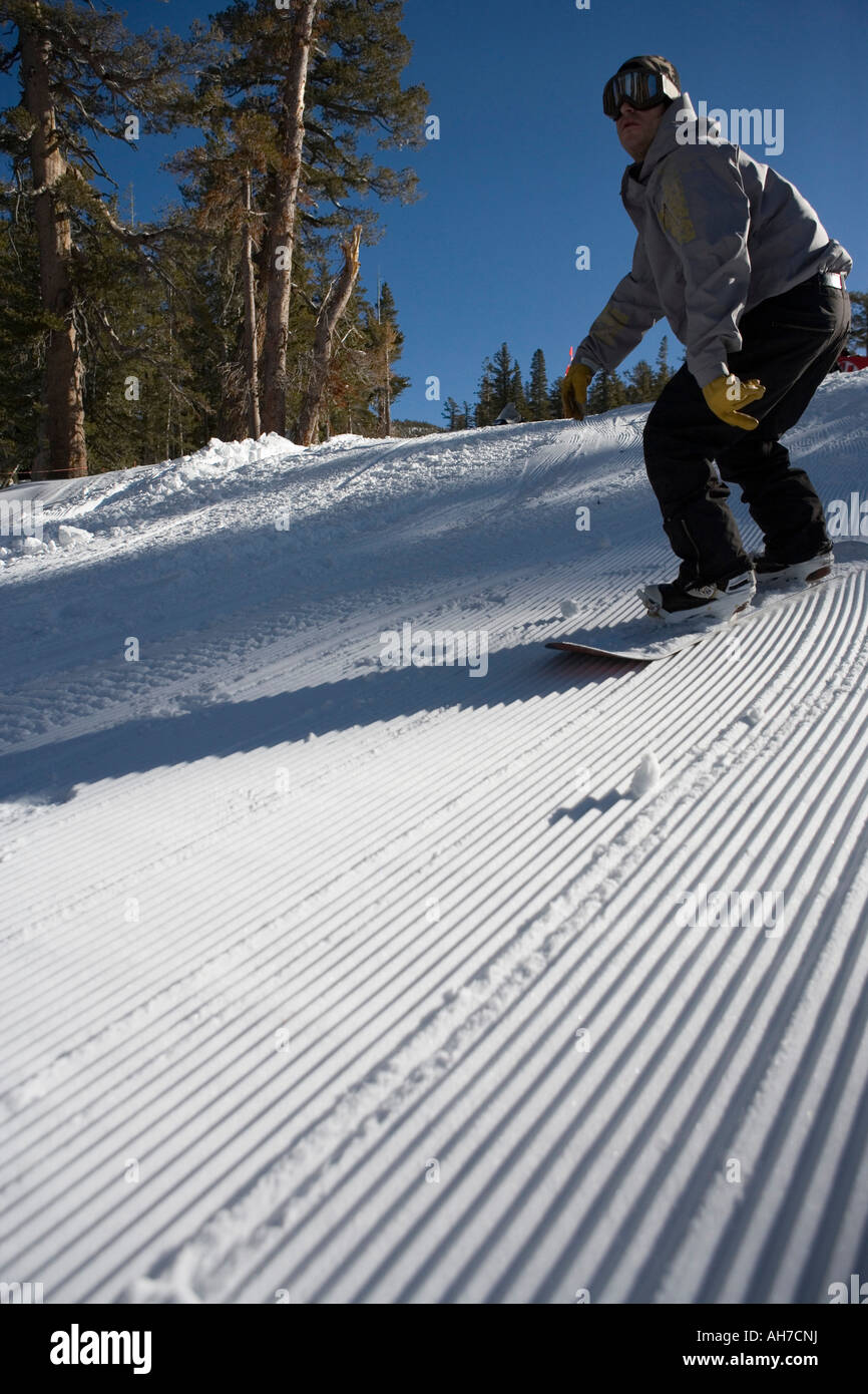 Man is snowboarding down a slope hi-res stock photography and images ...
