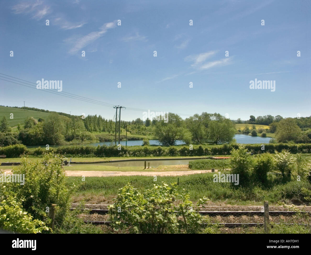 Railway line and Wilton Water alongside the Kennet and Avon Canal at ...