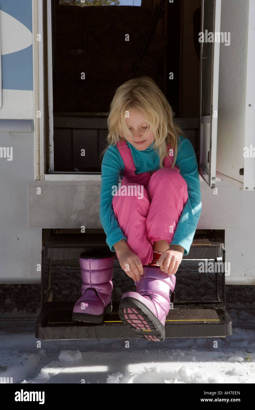Girl putting on boot hi-res stock photography and images - Alamy