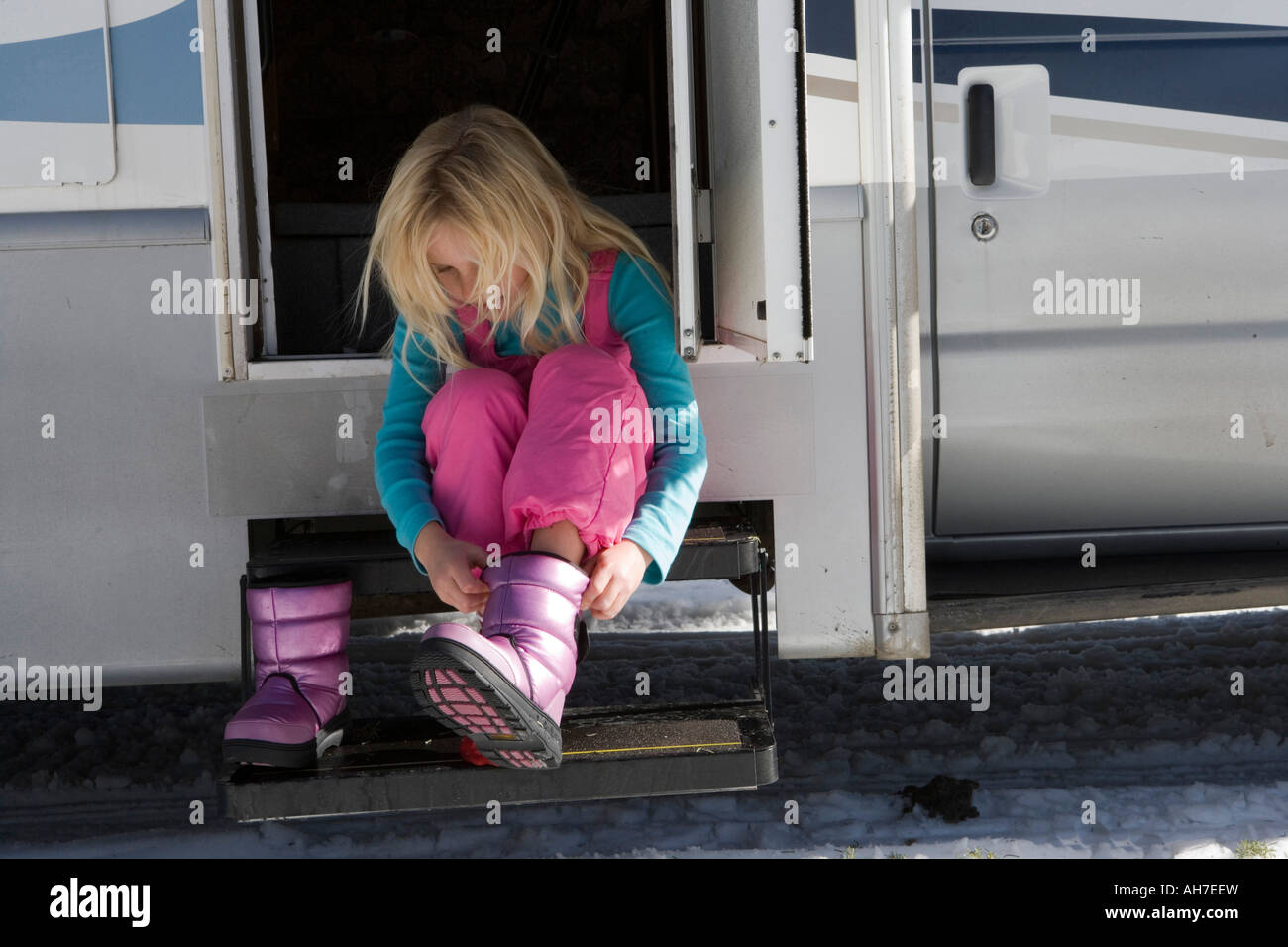 Girl putting on boot hi-res stock photography and images - Alamy