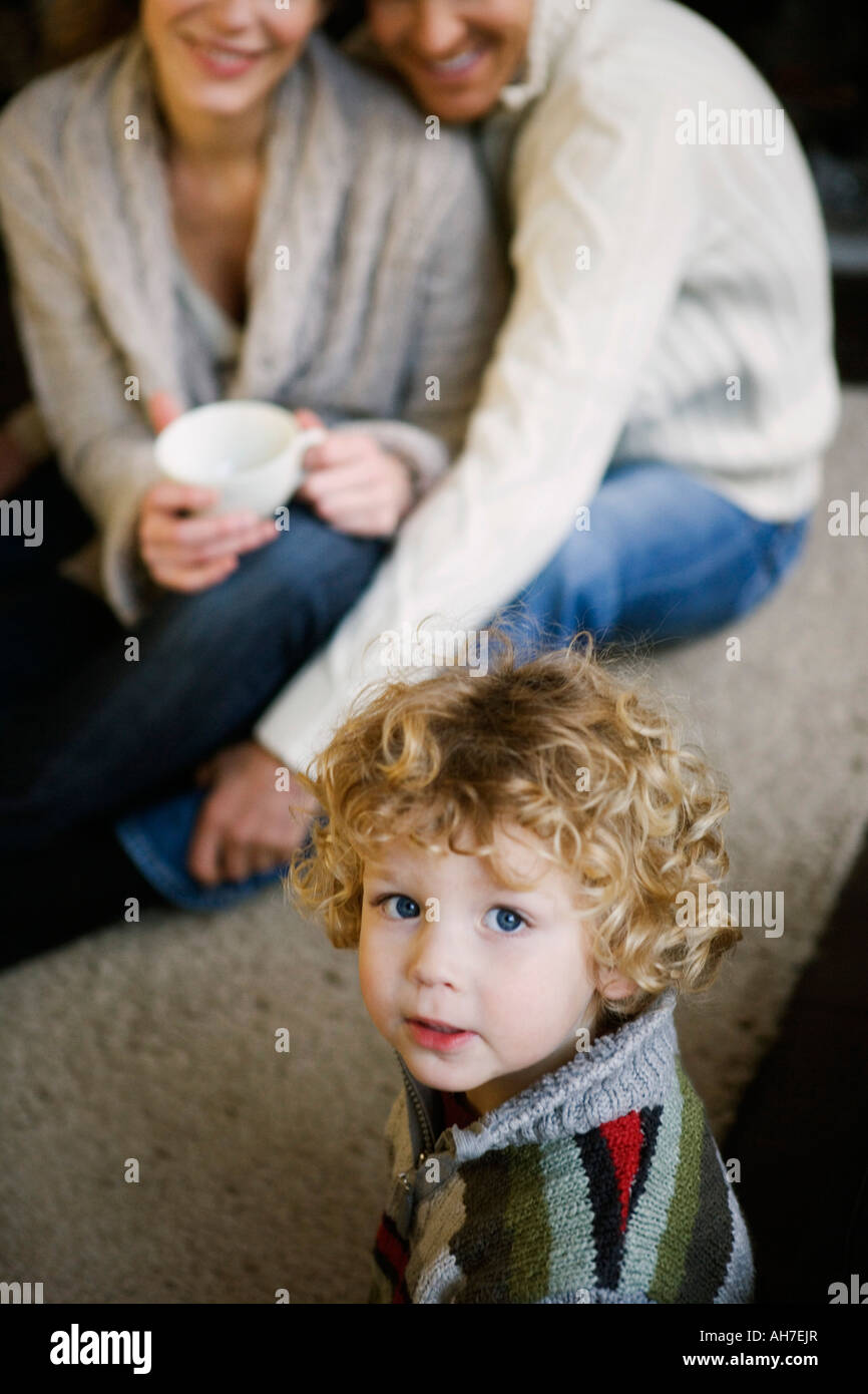 Portrait of a boy with his parents sitting behind him Stock Photo - Alamy