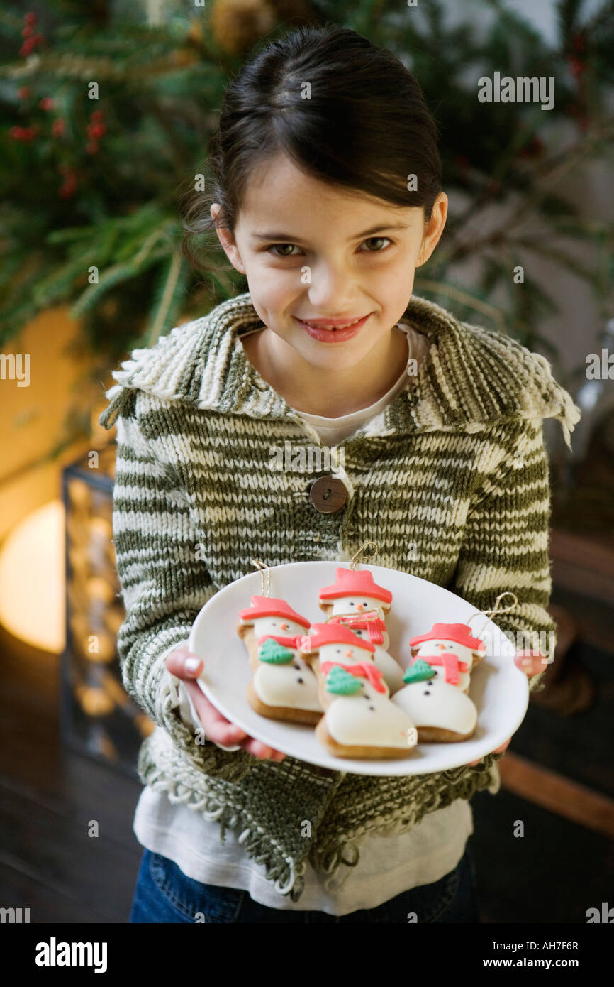 Girl holding a plate of cookies Stock Photo - Alamy
