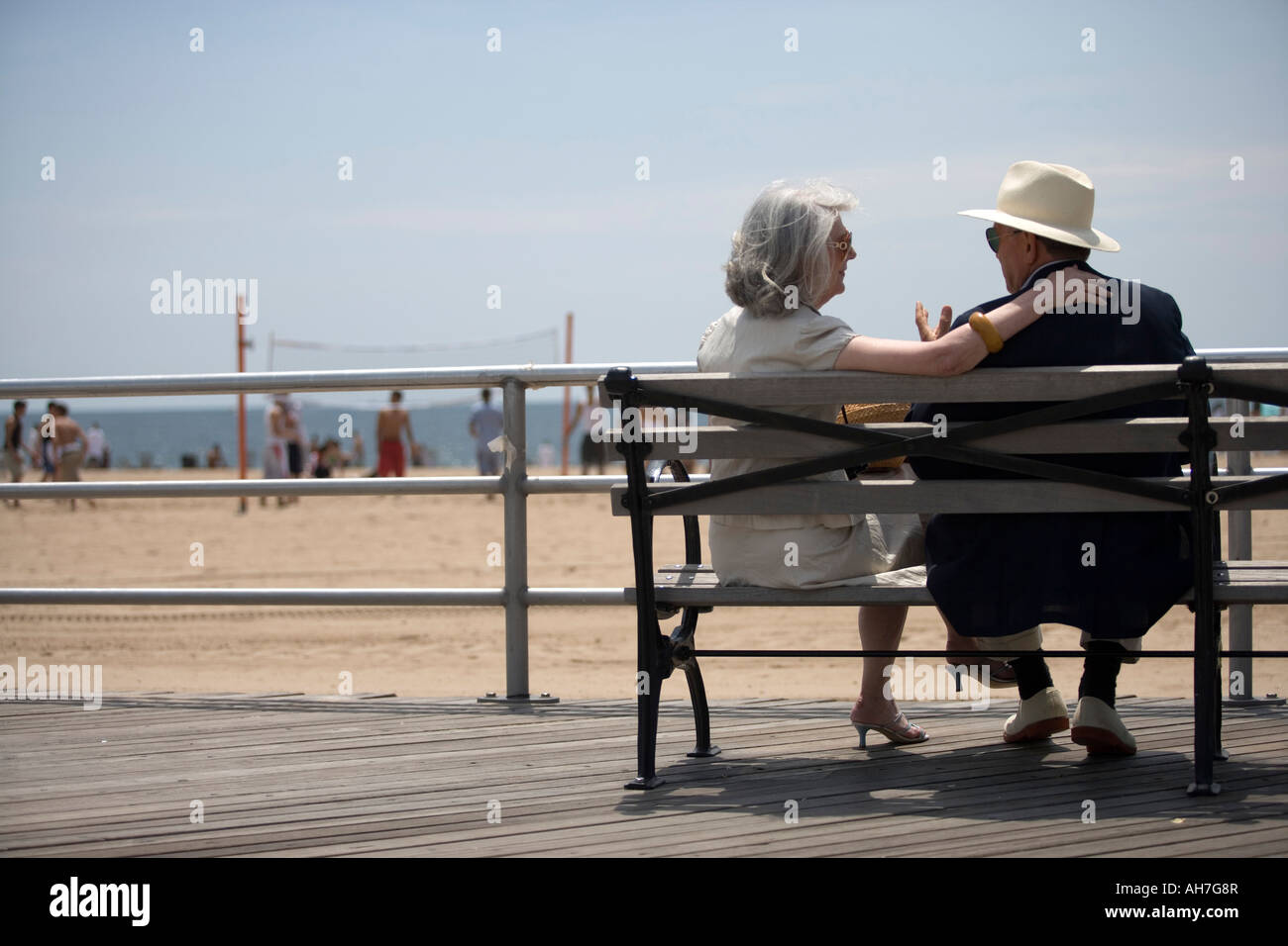 Rear view of a senior couple sitting on a bench Stock Photo - Alamy