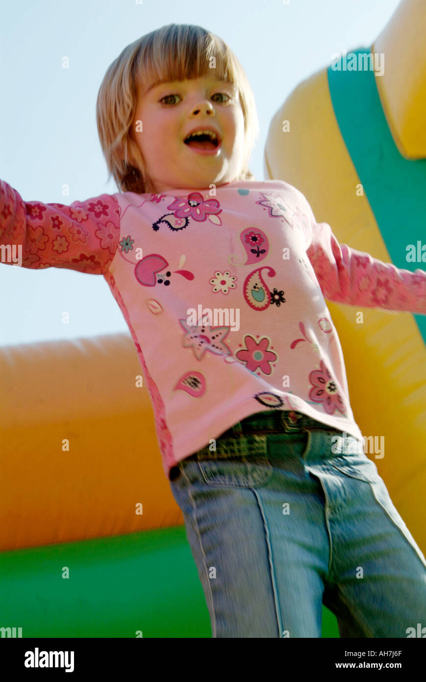 happy child playing on a bouncy castle play fun enjoy enjoyment fun ...