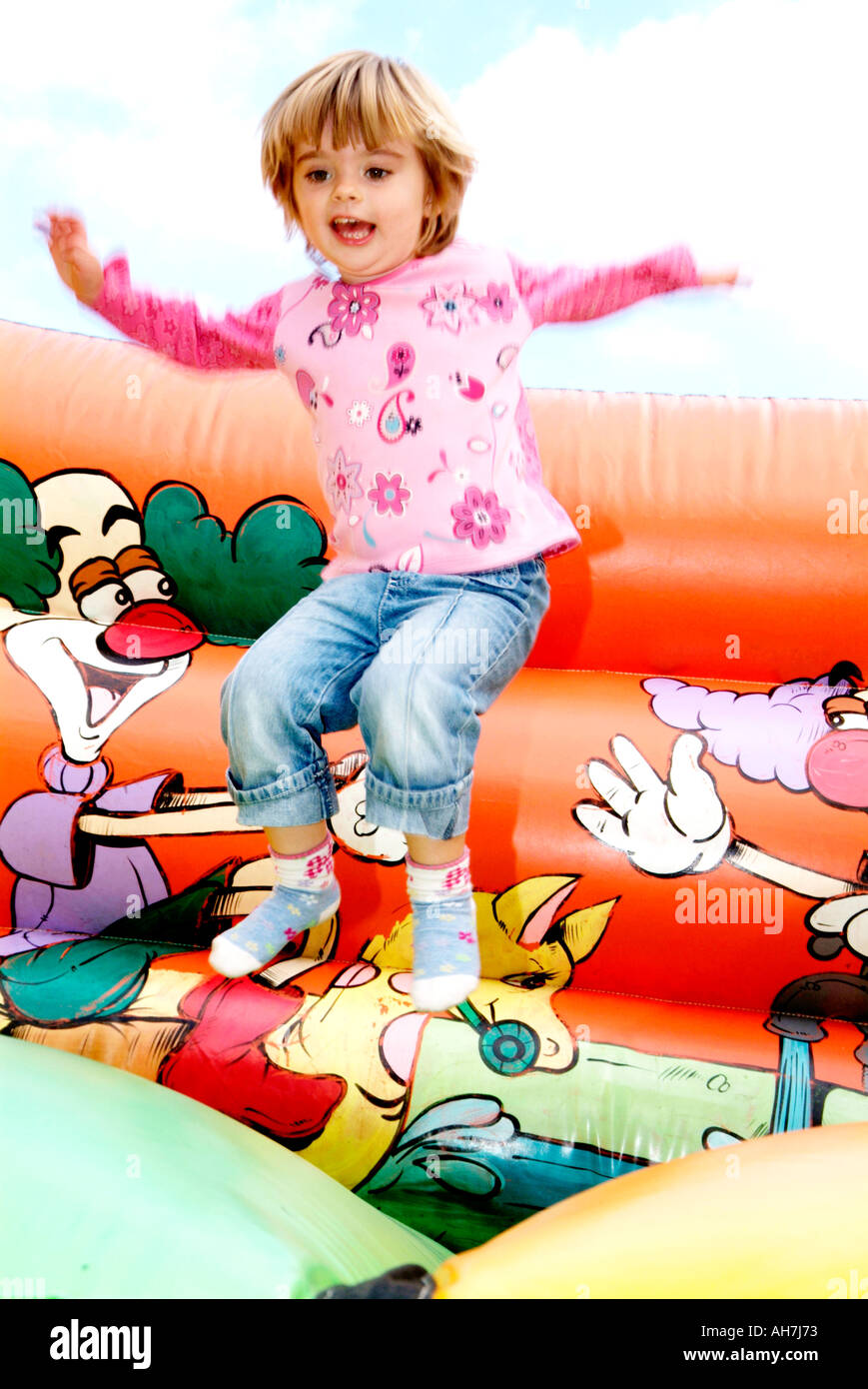 happy child playing on a bouncy castle play fun enjoy enjoyment fun ...