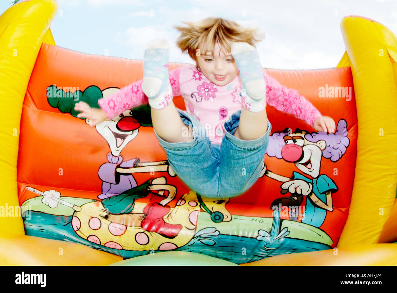 happy child playing on a bouncy castle play fun enjoy enjoyment fun ...