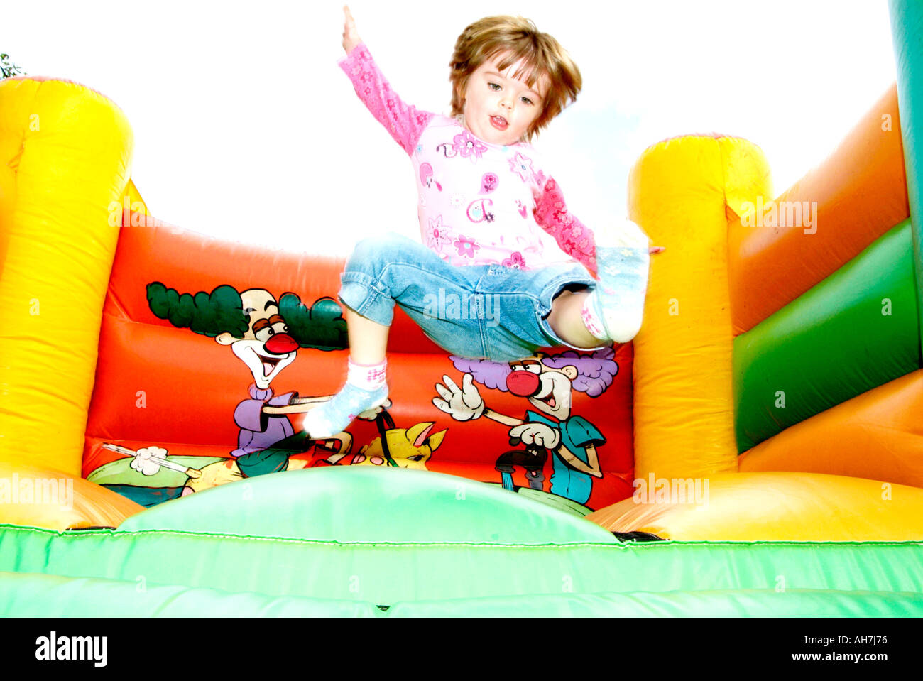 happy child playing on a bouncy castle play fun enjoy enjoyment fun ...