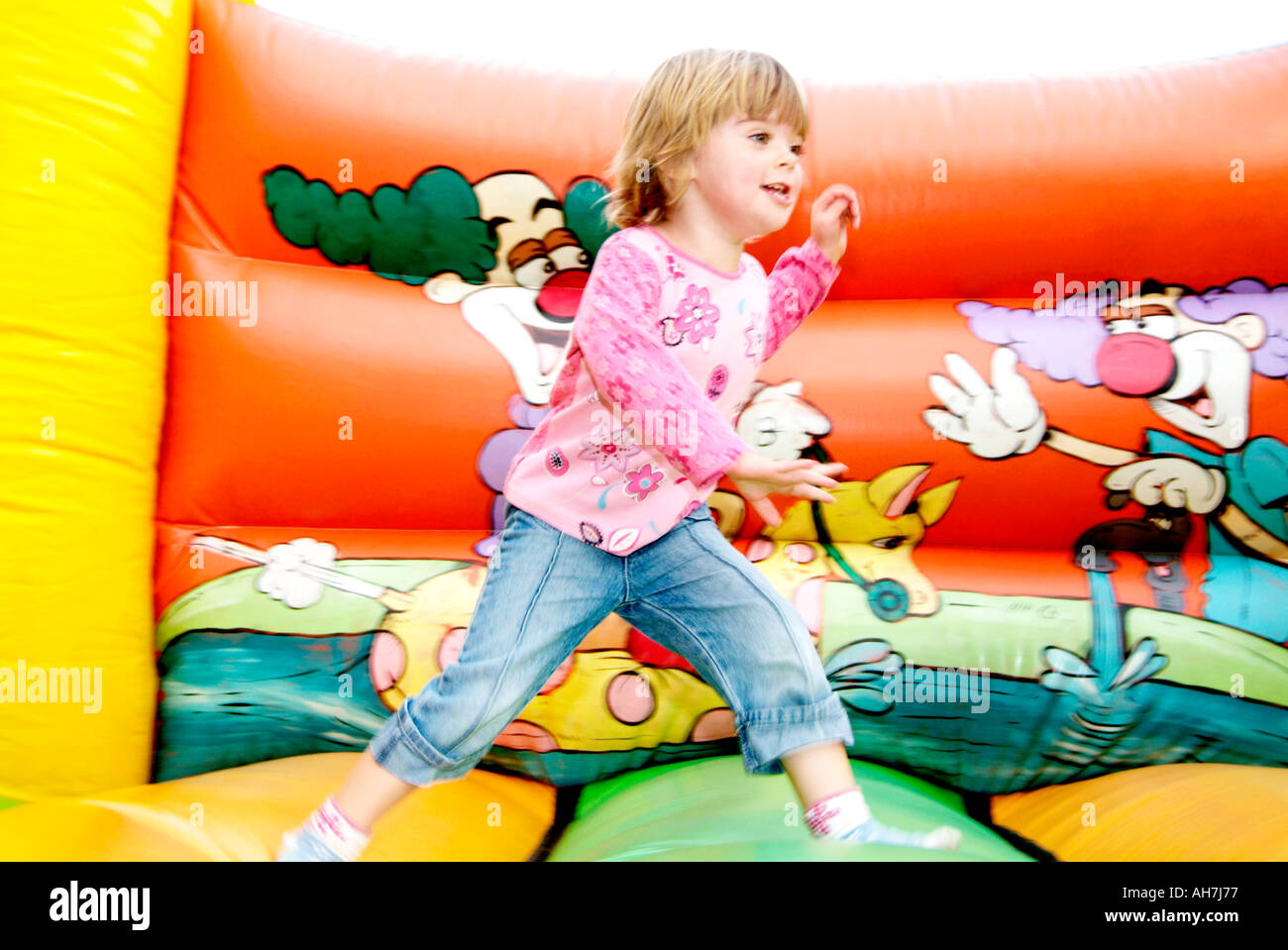 happy child playing on a bouncy castle play fun enjoy enjoyment fun ...