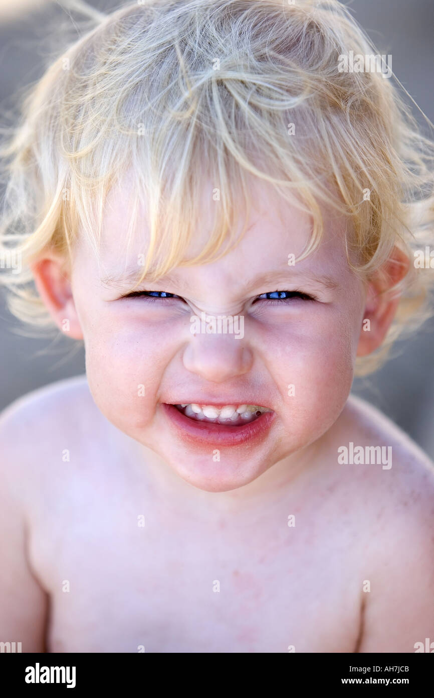 Young girl or child pulling and making silly face Stock Photo - Alamy