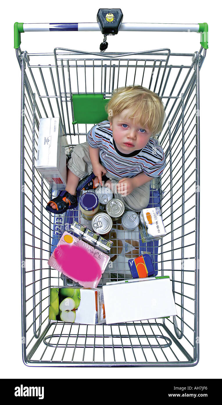 Aerial photo of young child or boy in a shopping trolley with white ...