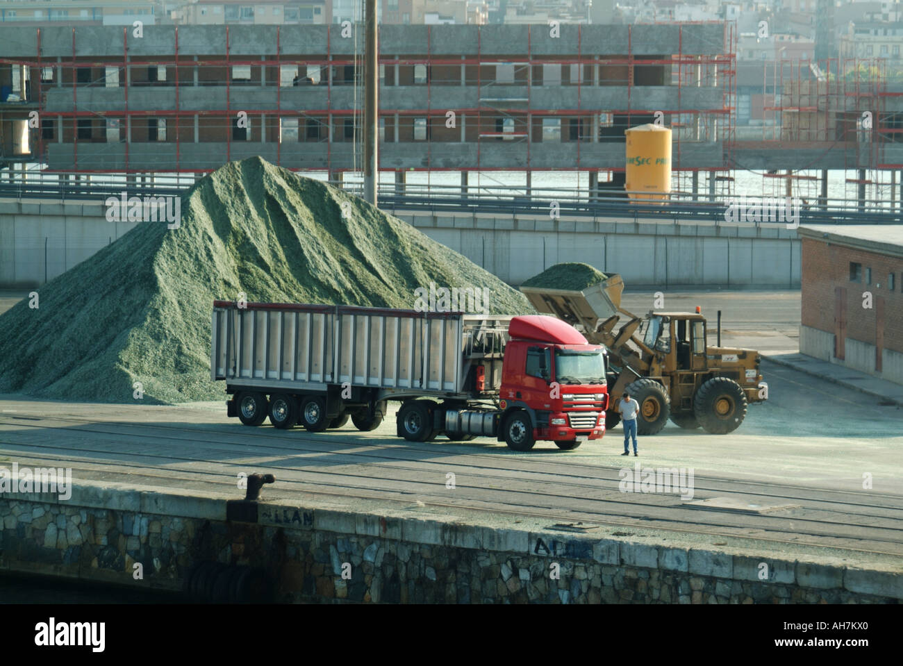 Tarragona port installations with bulk carrier lorry truck being loaded ...
